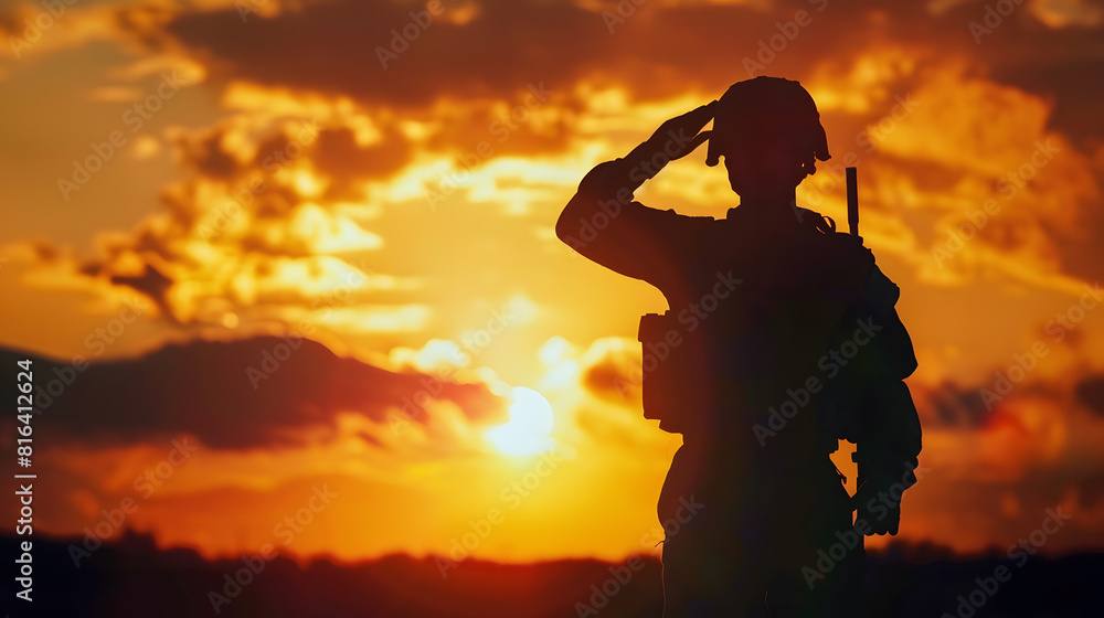 Silhouette of soldier in combat helmet and ammunition saluting on ...