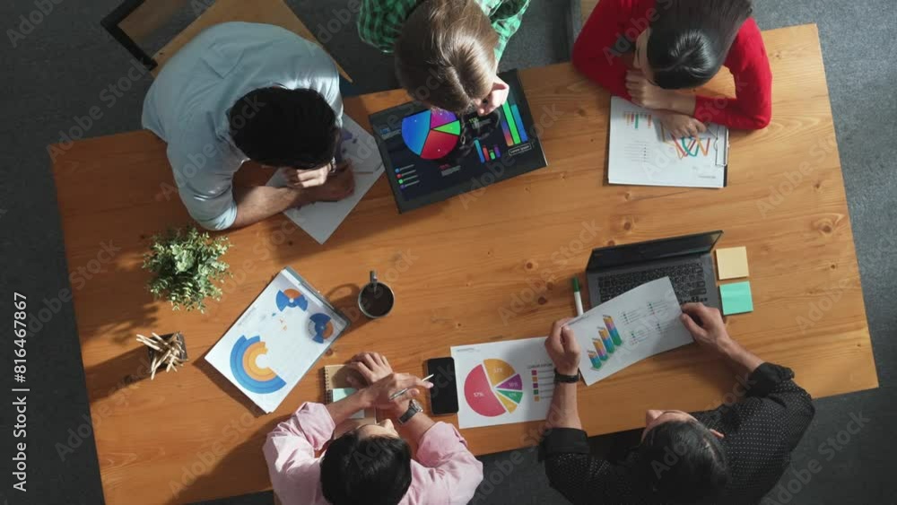 Top down view of business woman explain and present financial chart ...