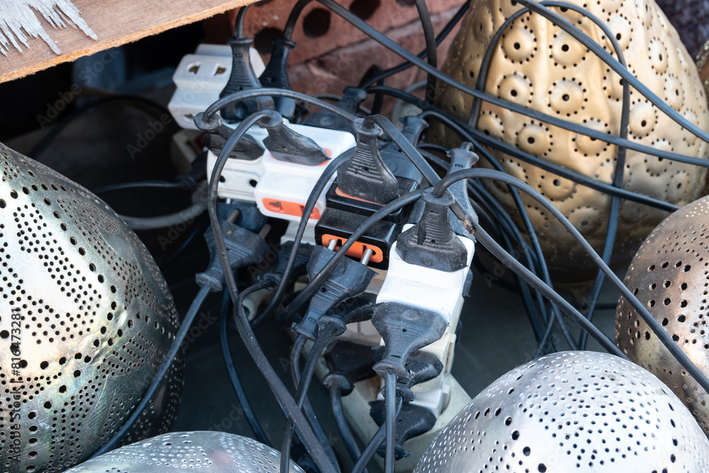 Old and damaged electric adapter power plug has many appliances are ...