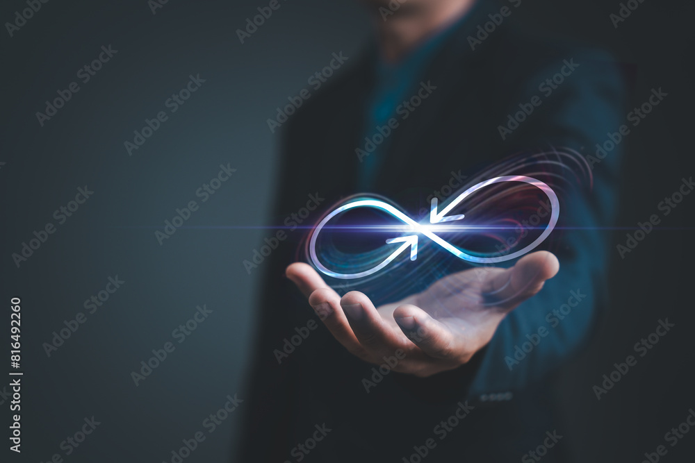 Businessman hands holding virtual infinity, Symbol of connect to ...