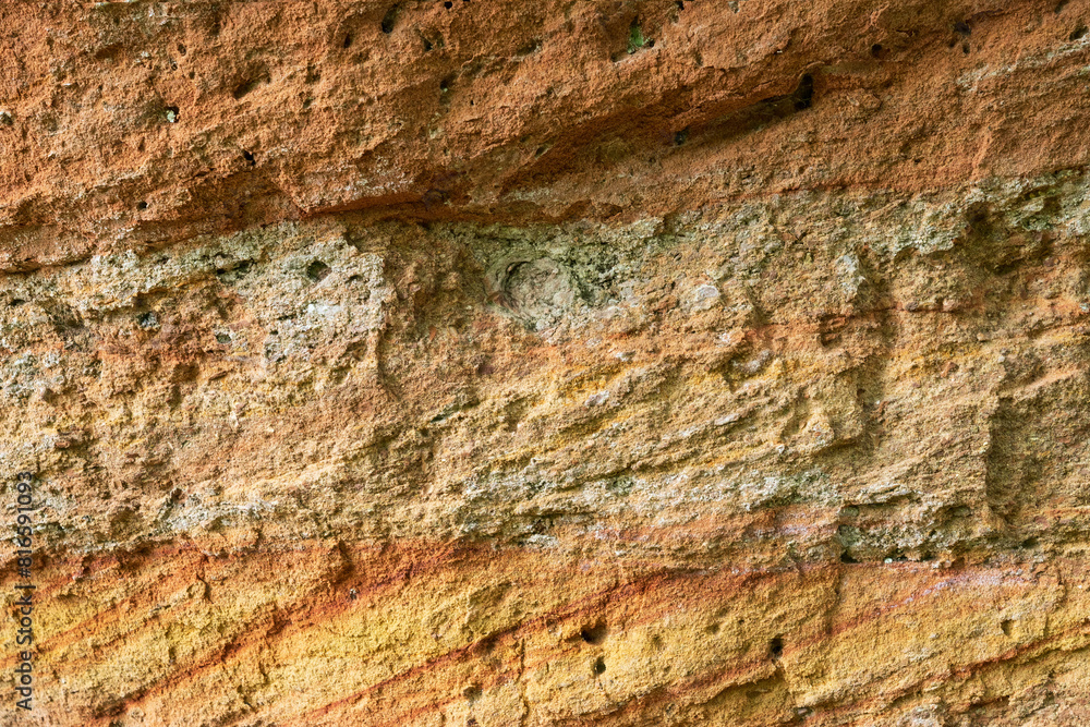 Ancient layers of clay and sand in layers of different colors ...
