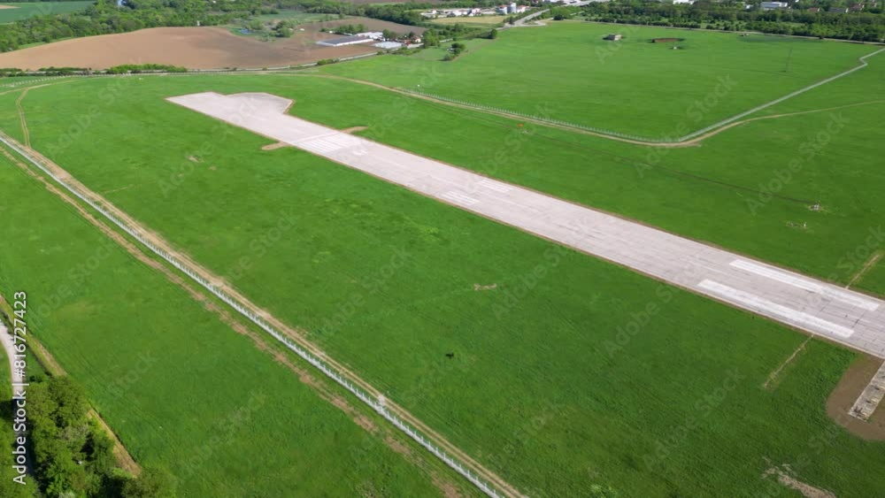 Aerial footage of rural airport runway taxiway and ramp. Airfield ...