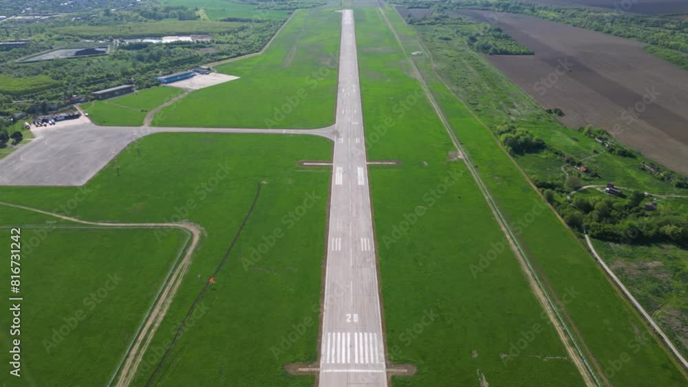 Aerial footage of rural airport runway taxiway and ramp. Airfield ...