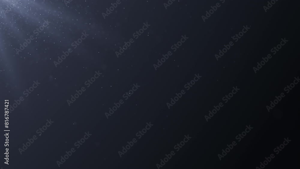 Flying particles of organic dust on a dark background in the light of a ...