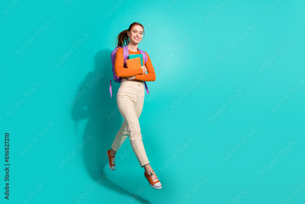 Full Size Photo Of Smart Girl Dressed Orange Shirt Backpack Hold Book