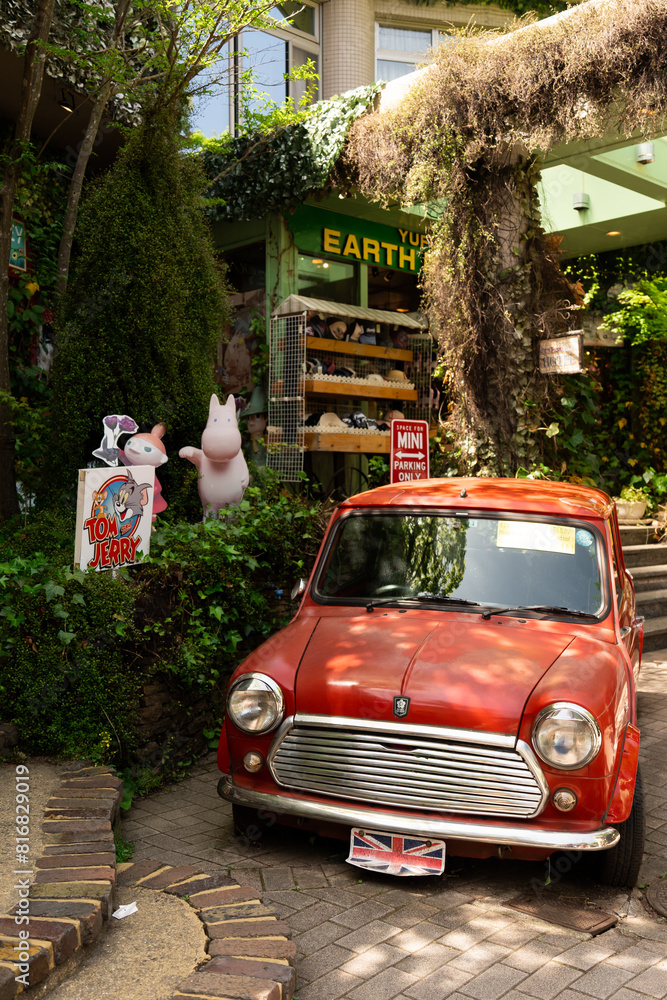 JAPAN - APR 17, 2024: A vintage red Mini car parking in whimsical ...