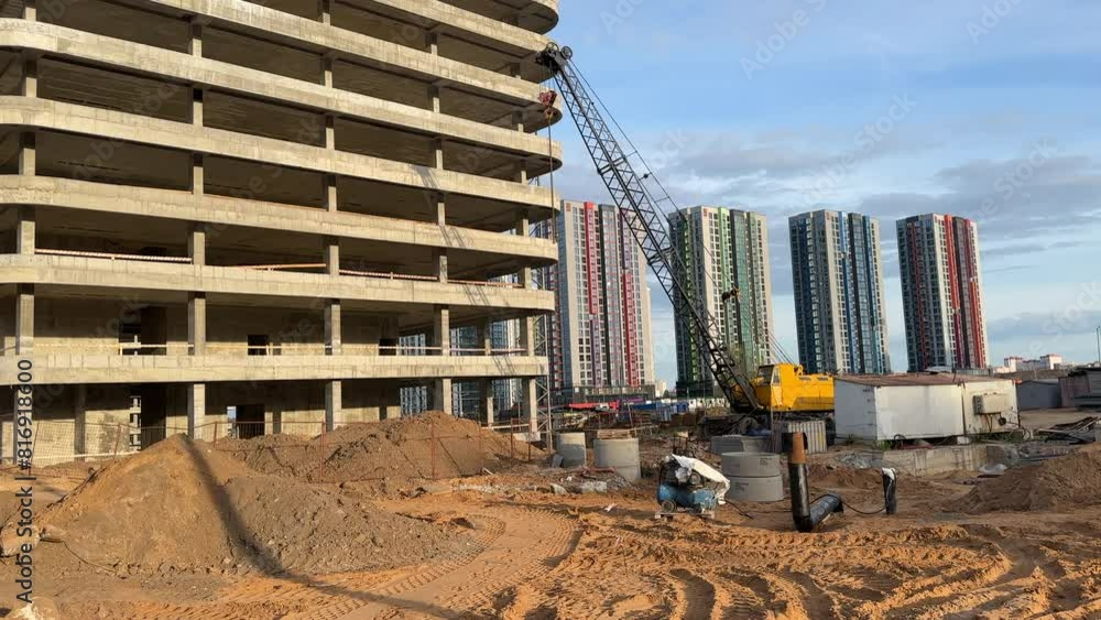 Construction site with buildings under construction. Tower cranes in ...