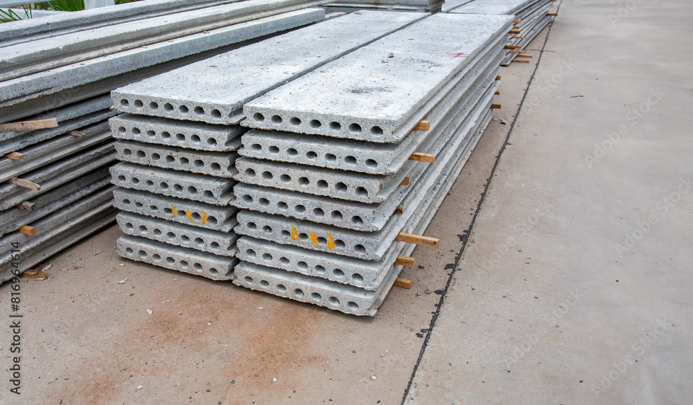 Stack of precast reinforced concrete slabs in house construction site ...