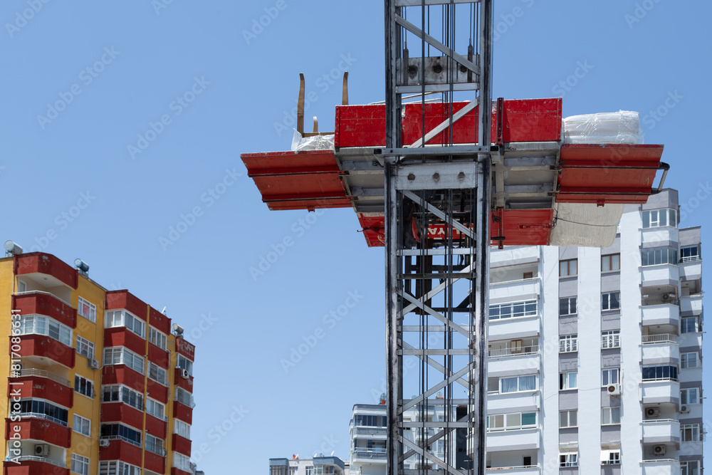 Transporting household goods by elevator to high-rise buildings by ...