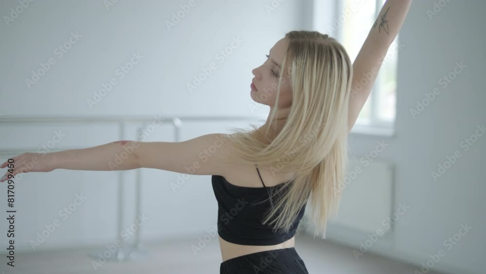 Fit girl in black clothes performing contemporary. Female dancer shows ...