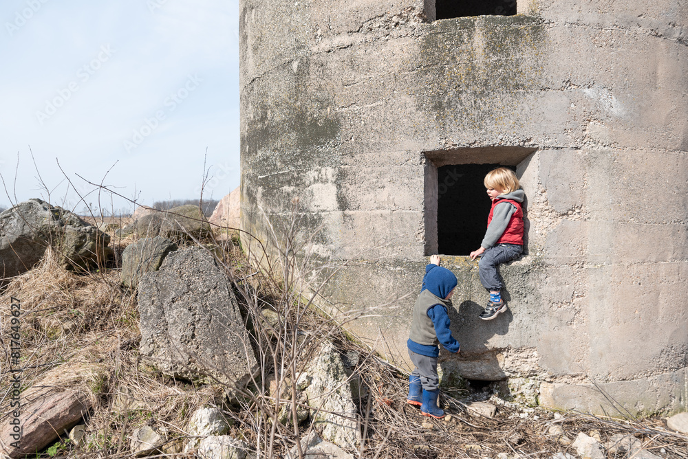 Kids playing on a concrete silo at a Huron County farm Stock Photo ...