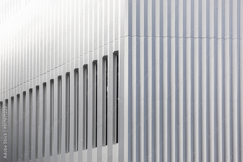 Architecture details of white concrete facade with pleat cement casting technique and voids ...