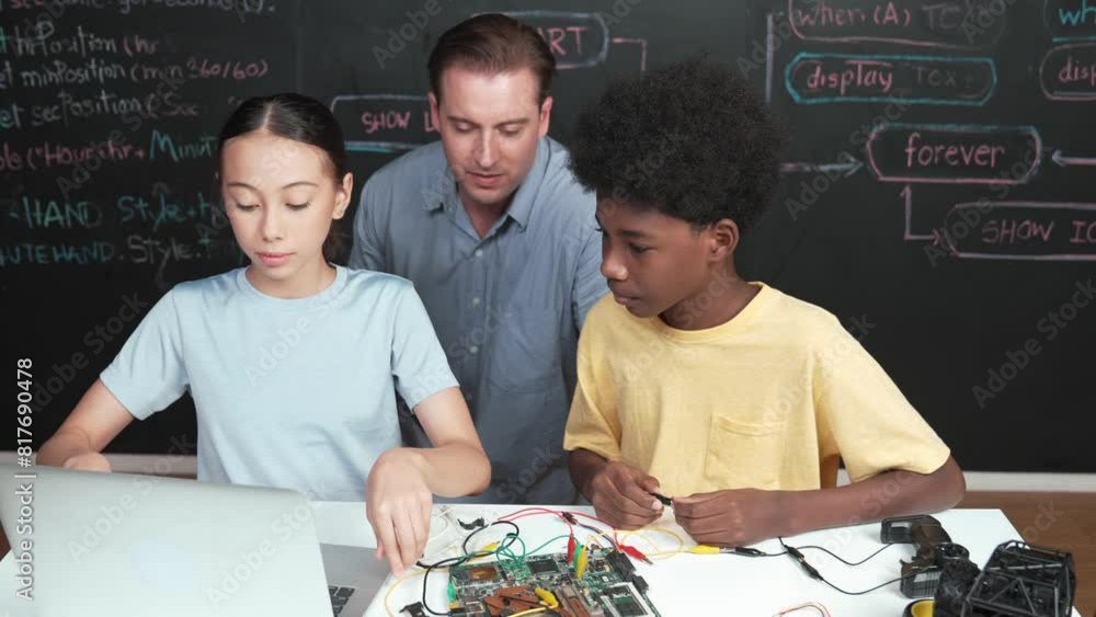 Smart mentor teach main board construction while diverse teenager ...