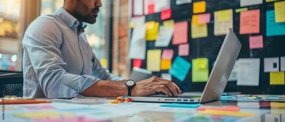Business developer using Kanban board framework on laptop computer ...