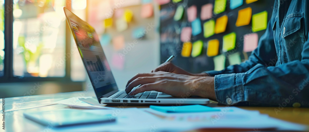 Business developer using Kanban board framework on laptop computer ...