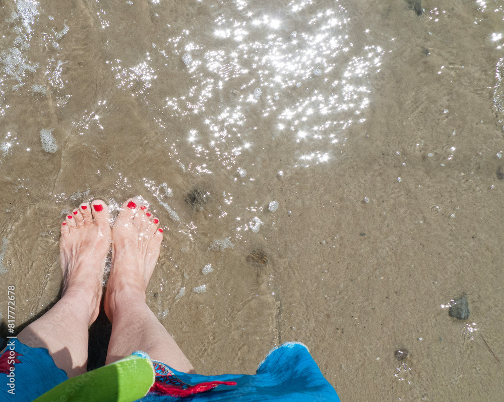 Earthing at the beach with bare feet in the wet sand. Earthing or ...