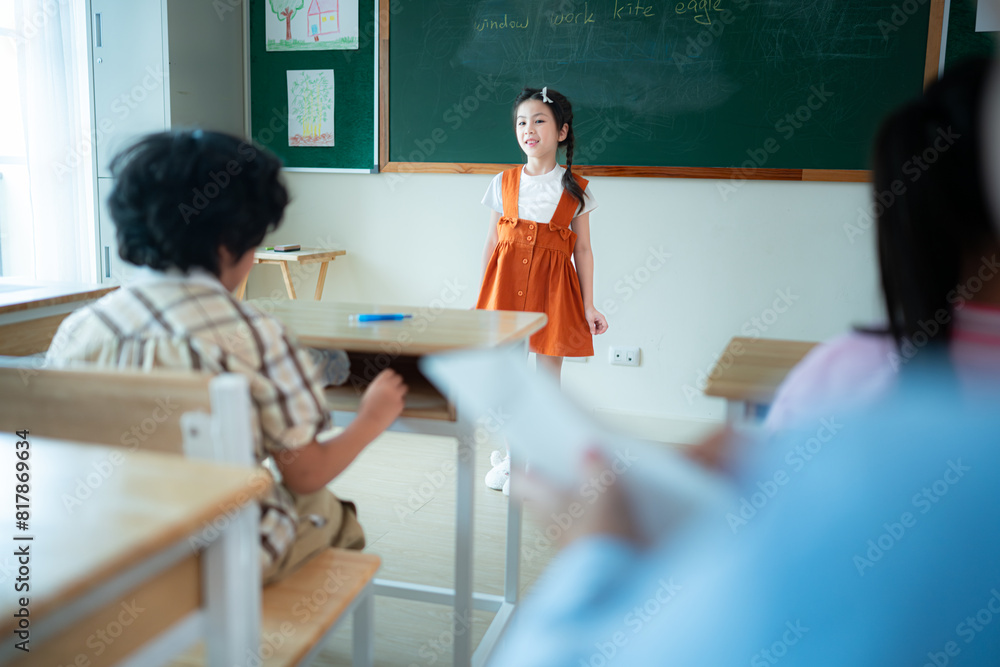 Children with classroom presentation activities in front of the ...