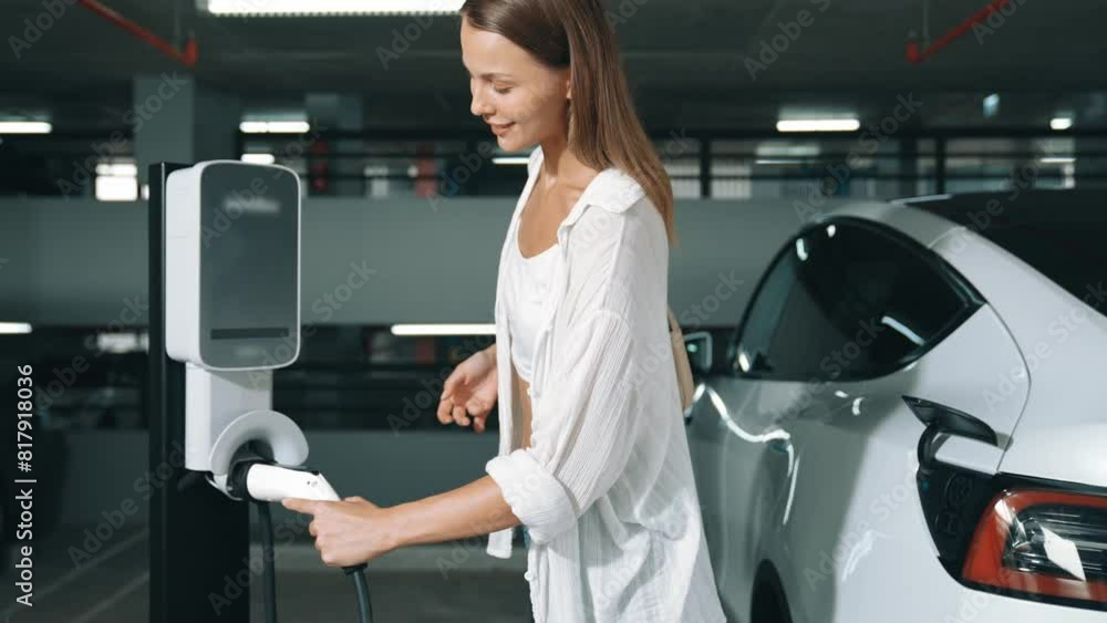 Slow motion woman happy and smile travel with EV electric car to shopp ...