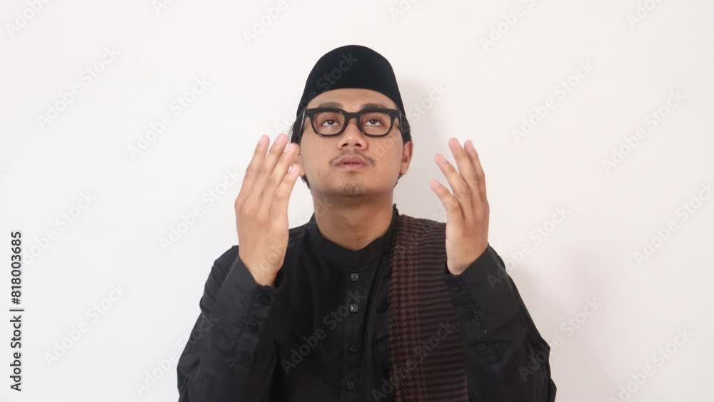 Footage of a Handsome young Asian Muslim man in Arabic costume standing ...