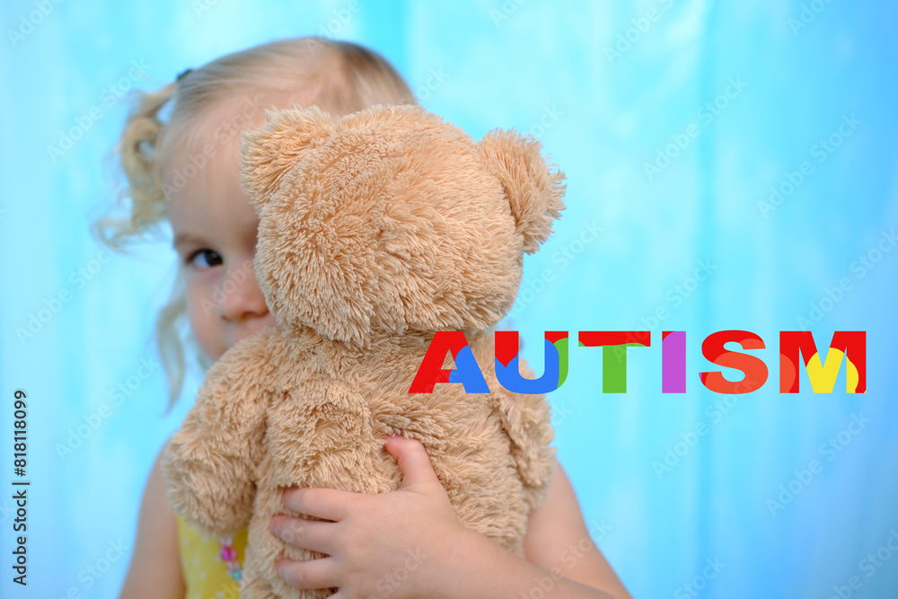 little child with autism, blonde girl 3 years old plays with toy, hugs ...