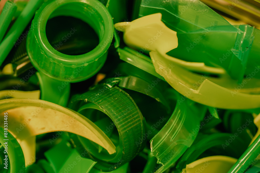 Recycling green plastic bottle caps to be reused for manufacturing. New ...