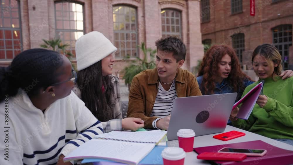 Group of diverse students talking animated working together using at ...