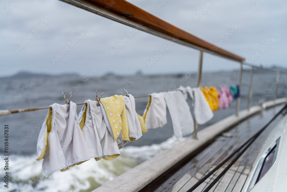 clothes drying on a washing line on a yacht boat traveling over the ...