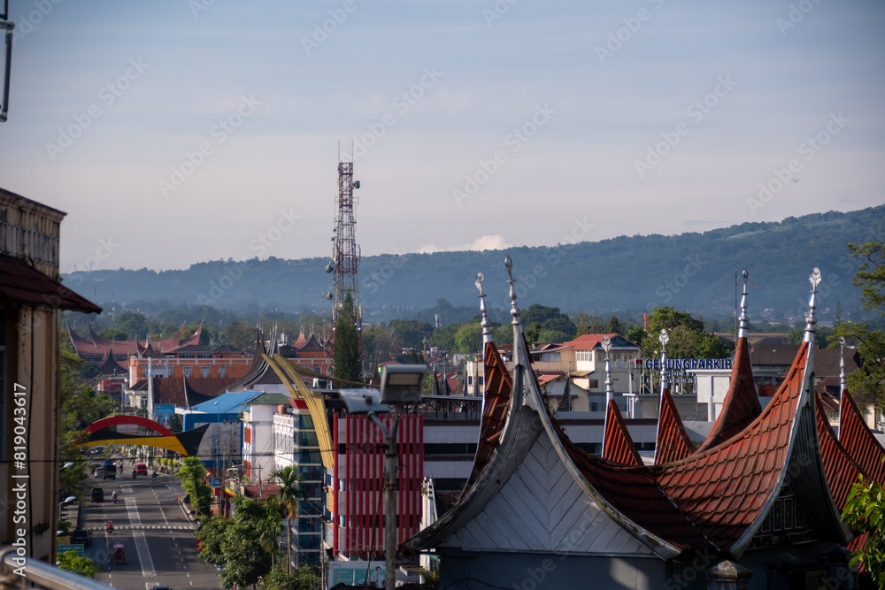 Bagonjong roofs are like buffalo horns on buildings near Jam Gadang in ...