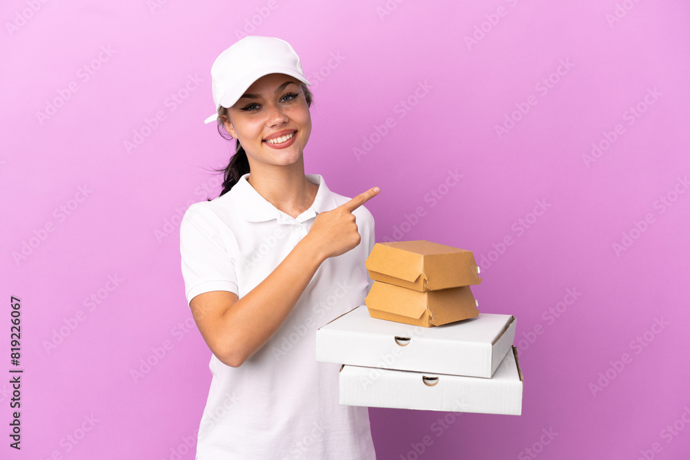 Pizza delivery Russian girl with work uniform picking up pizza boxes ...