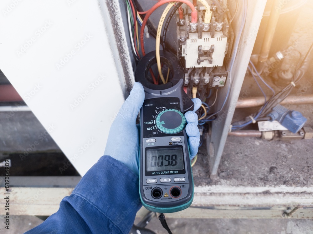 Checking the electric current in the HVAC air conditioning electrical ...