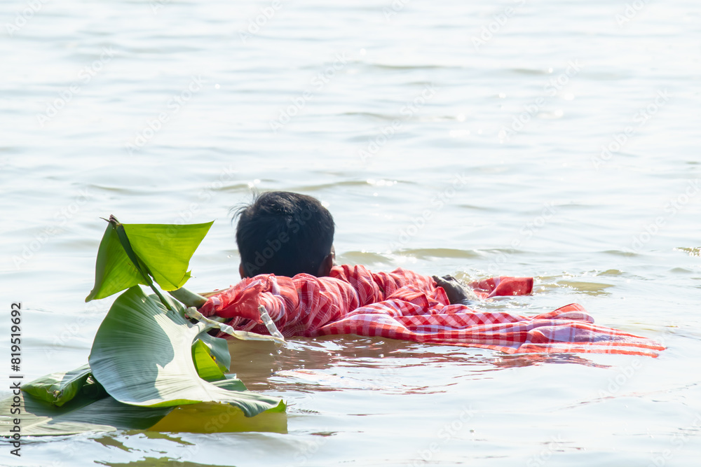 Durga puja ritual of kolabou snan is done by bathing a banana tree in ...