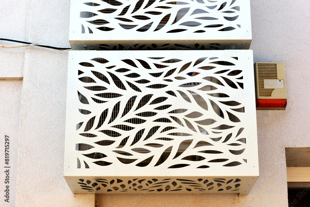 elegant laser cut steel cover box over exterior wall installed air ...