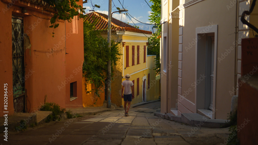 Person walking in a colorful alley in Athens, Greece Stock Photo ...