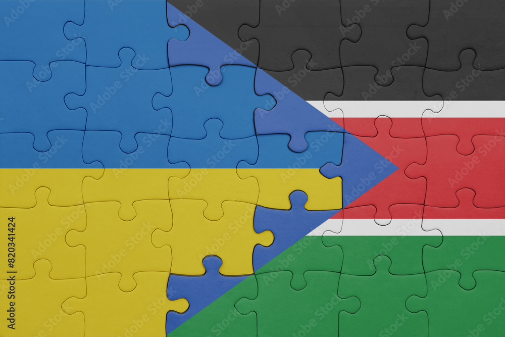 puzzle with the colourful national flag of south sudan and flag of ...
