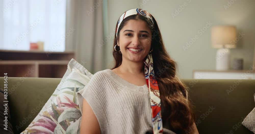 Indian girl, face and happy on sofa in home for stress relief, peace and calm on weekend break ...