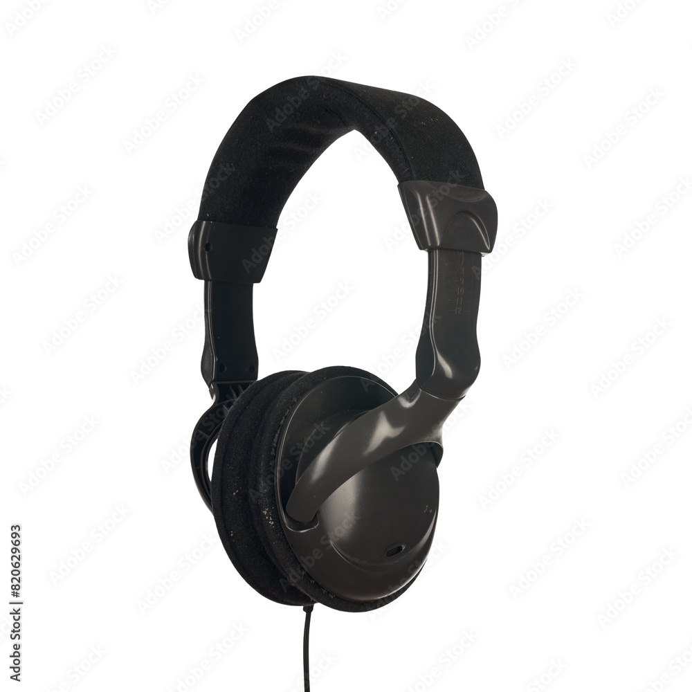 Music or podcast background with old black audio headphones, Echoes of the past: Isolated old ...
