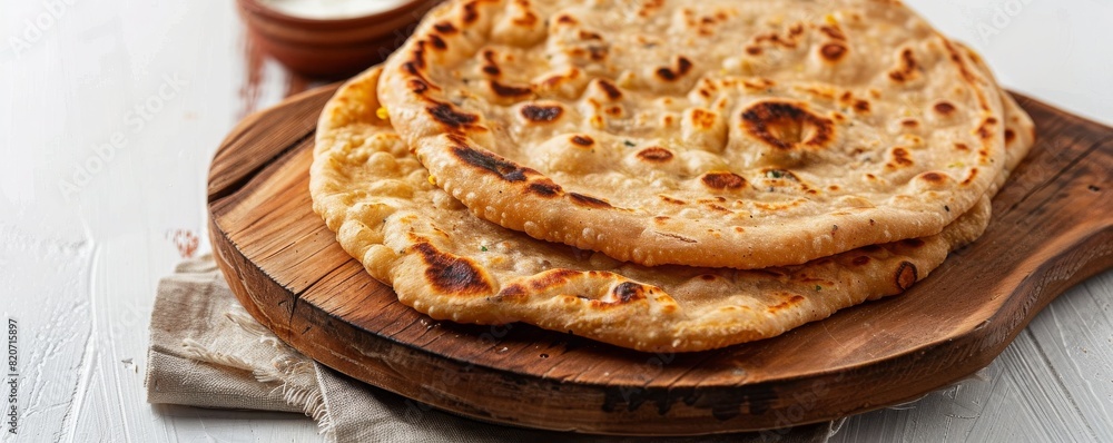 closeup of indian flatbread stuffed with potatoes, aloo paratha served ...