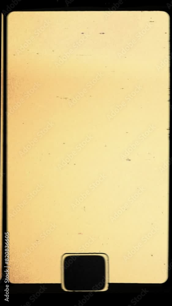 Vertical 4K film frame with sprocket yellow light leak and noise ...