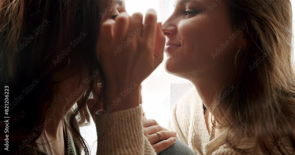 The girls look into each other's eyes and smile beautifully. sweet kiss ...