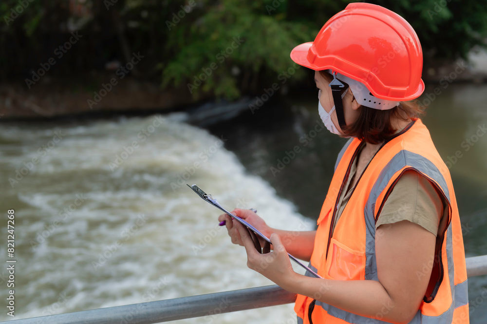 Asian Female engineering working . at sewage treatment plant,Marine ...