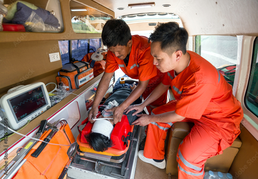 A person is wearing an oxygen mask, getting help from paramedic in ...