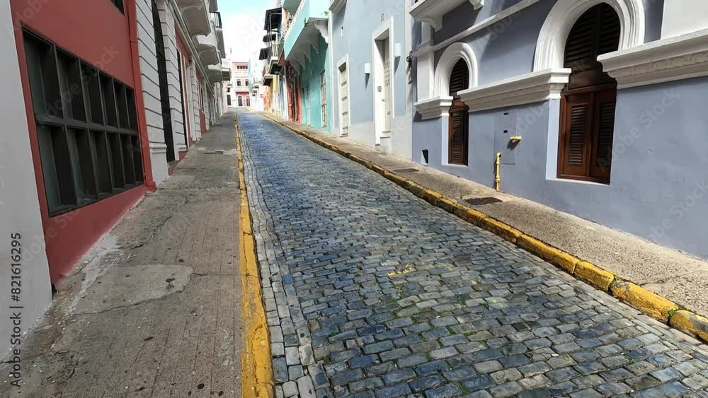 looking up at colorful colonial street in old san juan puerto rico ...