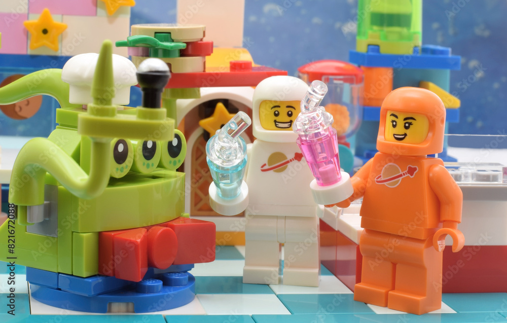 Lego minifigures of two astronauts in space suits in burger cafe have a ...