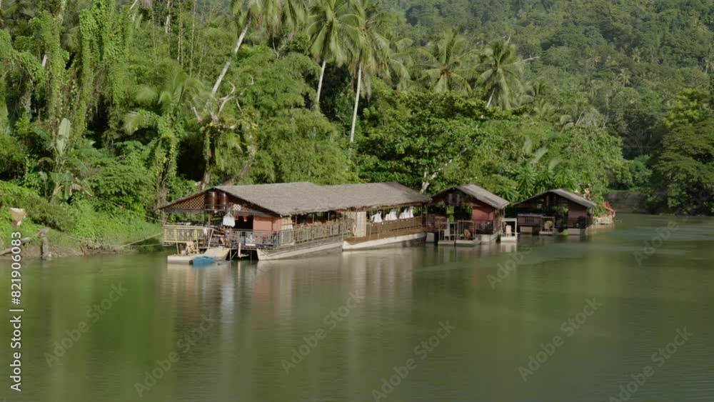 The Loboc River in the Philippines features houses built on its surface ...