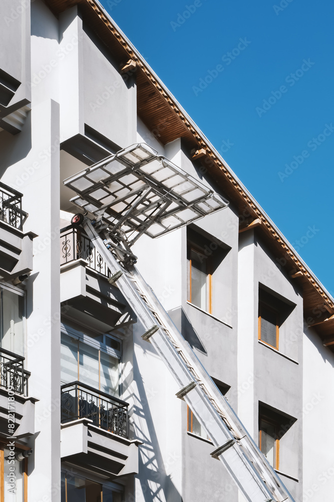 Platform elevator for delivering furniture to apartment through window ...