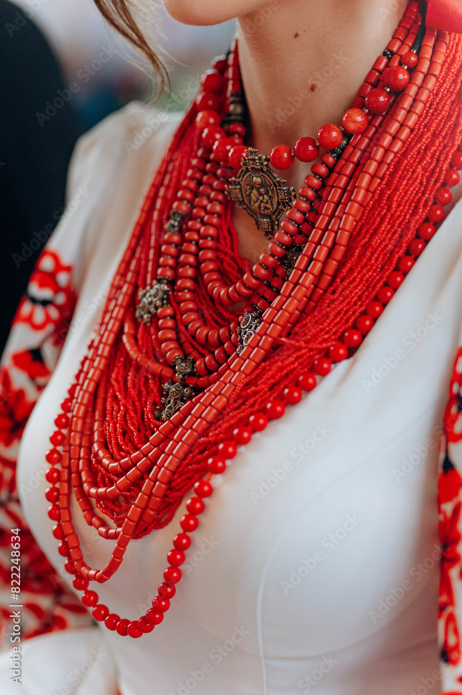 Ukrainian woman in embroidery vyshyvanka dress and ancient coral beads ...