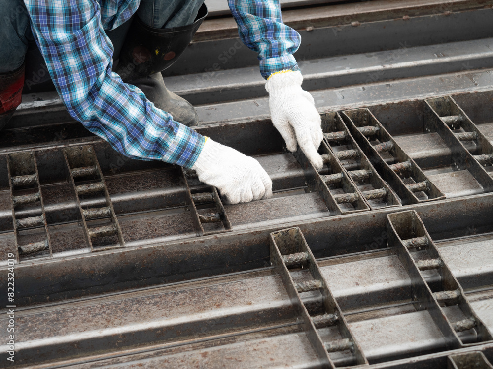 The worker adjusted steel wire in concrete formwork before pouring ...