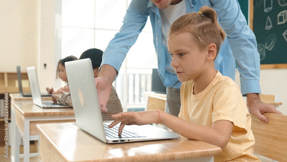 Smart caucasian boy using laptop to generated AI by coding engineering prompt. Diverse student ...