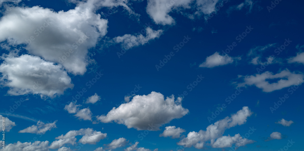 Sun shining through the puffy clouds. Sky view. Beautiful sunny sky ...