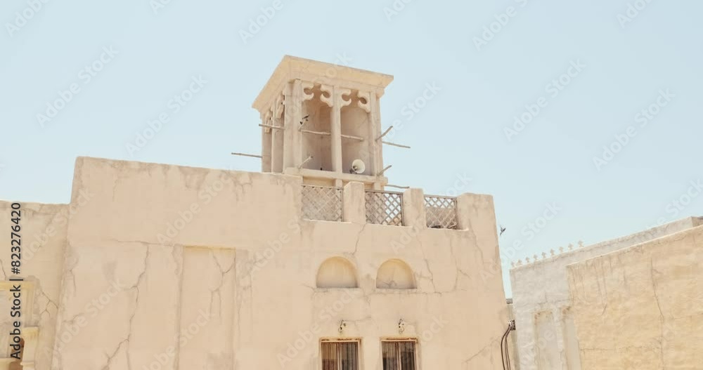 House in traditional Arabic architecture with wind tower. Traditional ...